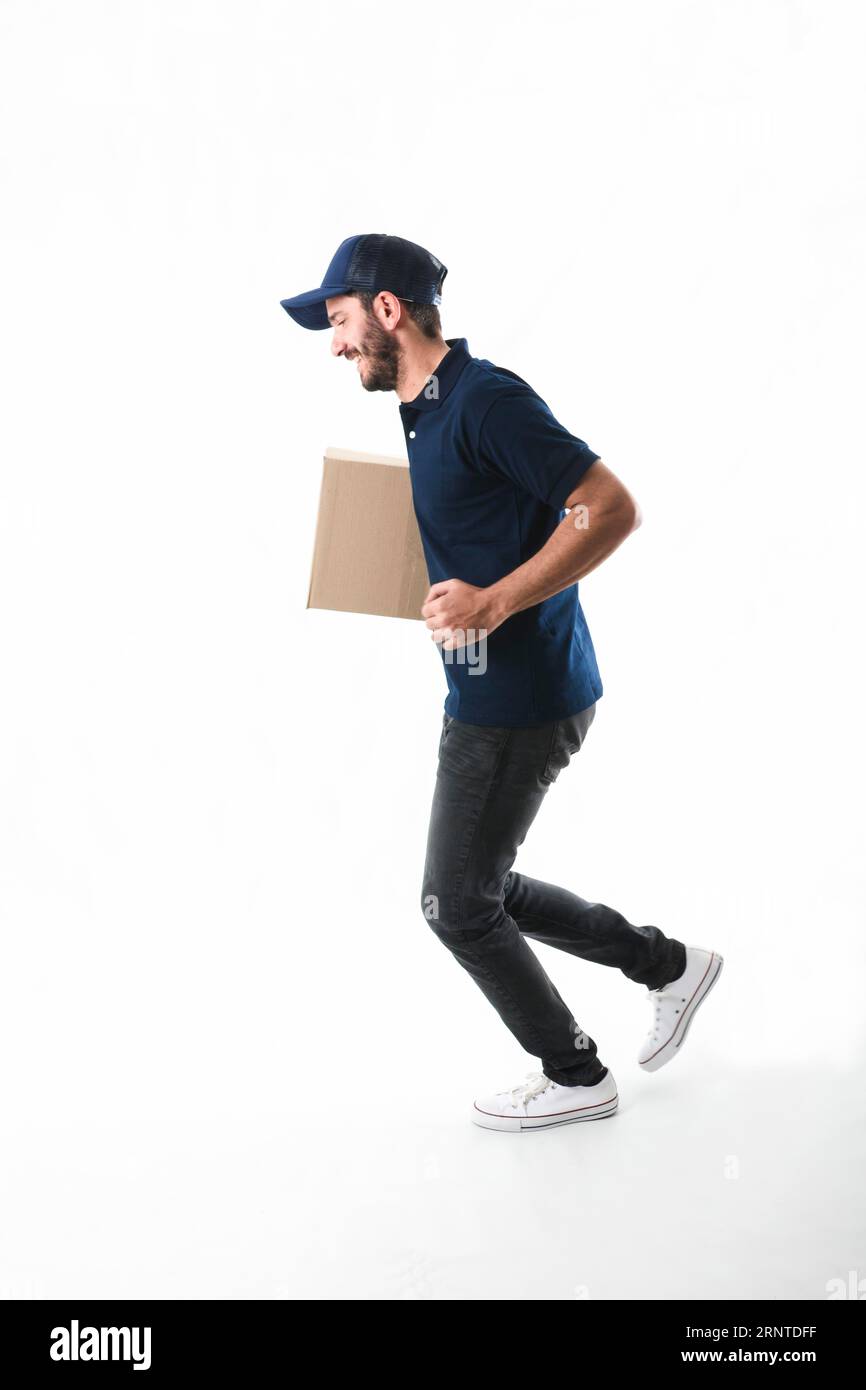 Delivery man with parcel running white background Stock Photo - Alamy