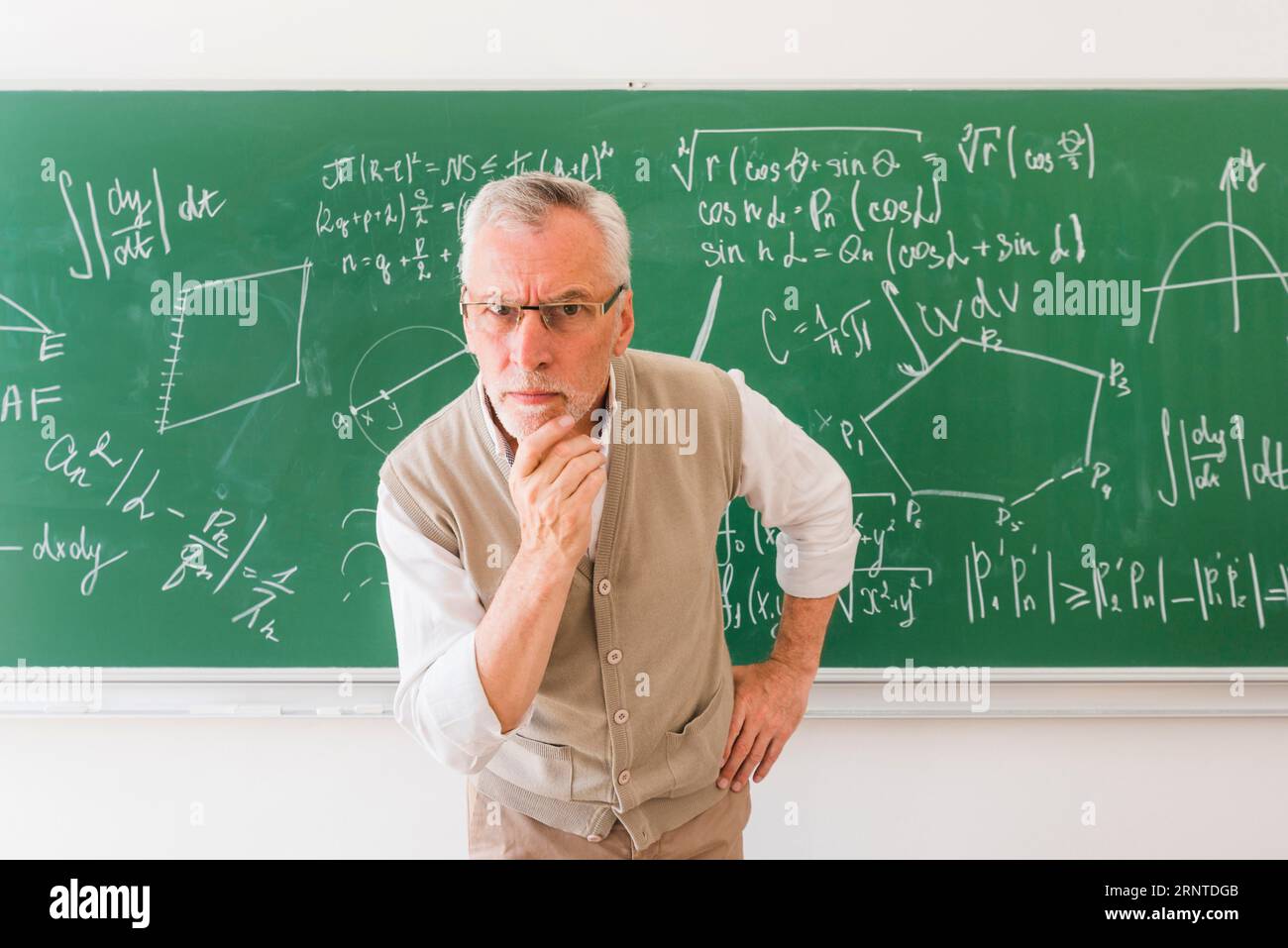 Elder professor classroom looking camera with question Stock Photo - Alamy