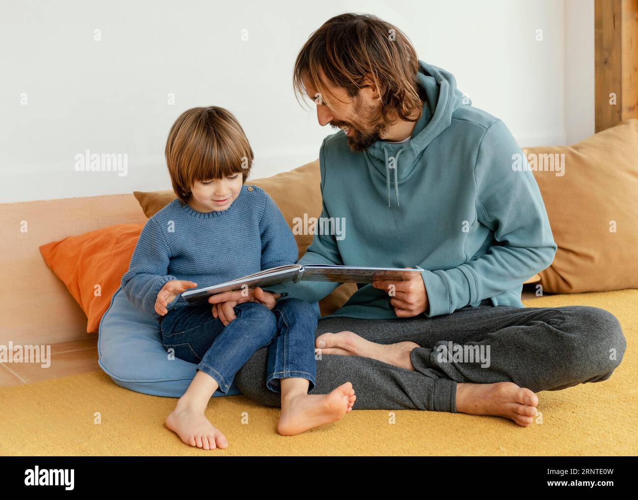 Father son reading book 2 Stock Photo - Alamy