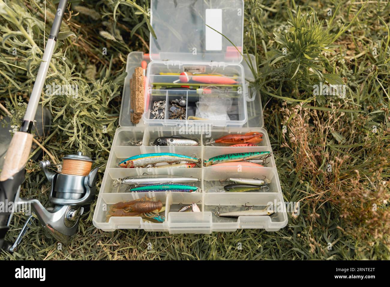 Fishing tool box ground Stock Photo - Alamy