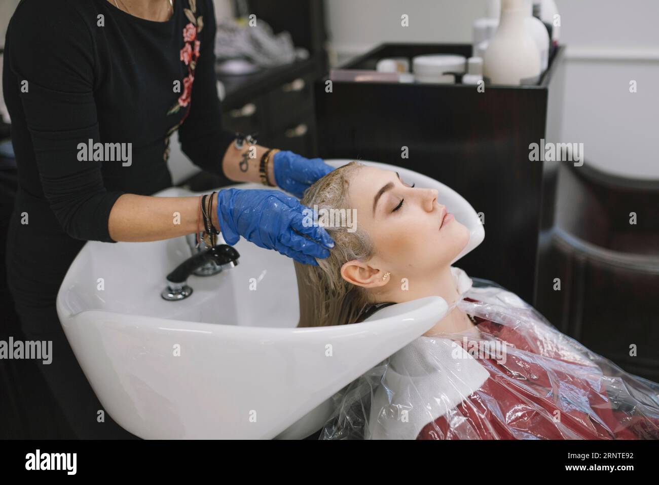 Hairdresser taking care client salon Stock Photo - Alamy Hairdresser taking care client salon Stock Photo - Alamy