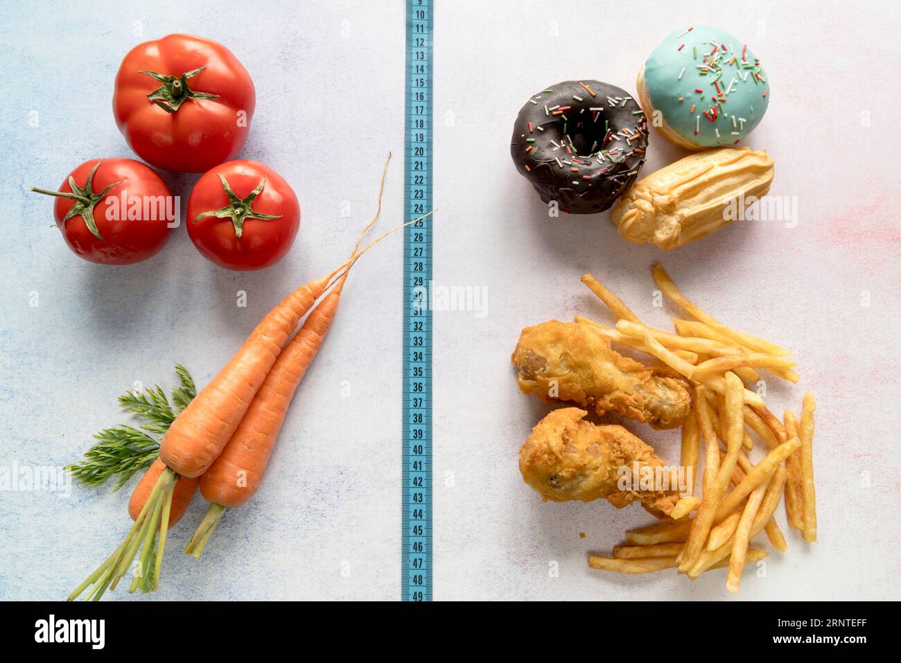 Healthy food unhealthy food divided from measurement tape Stock Photo ...