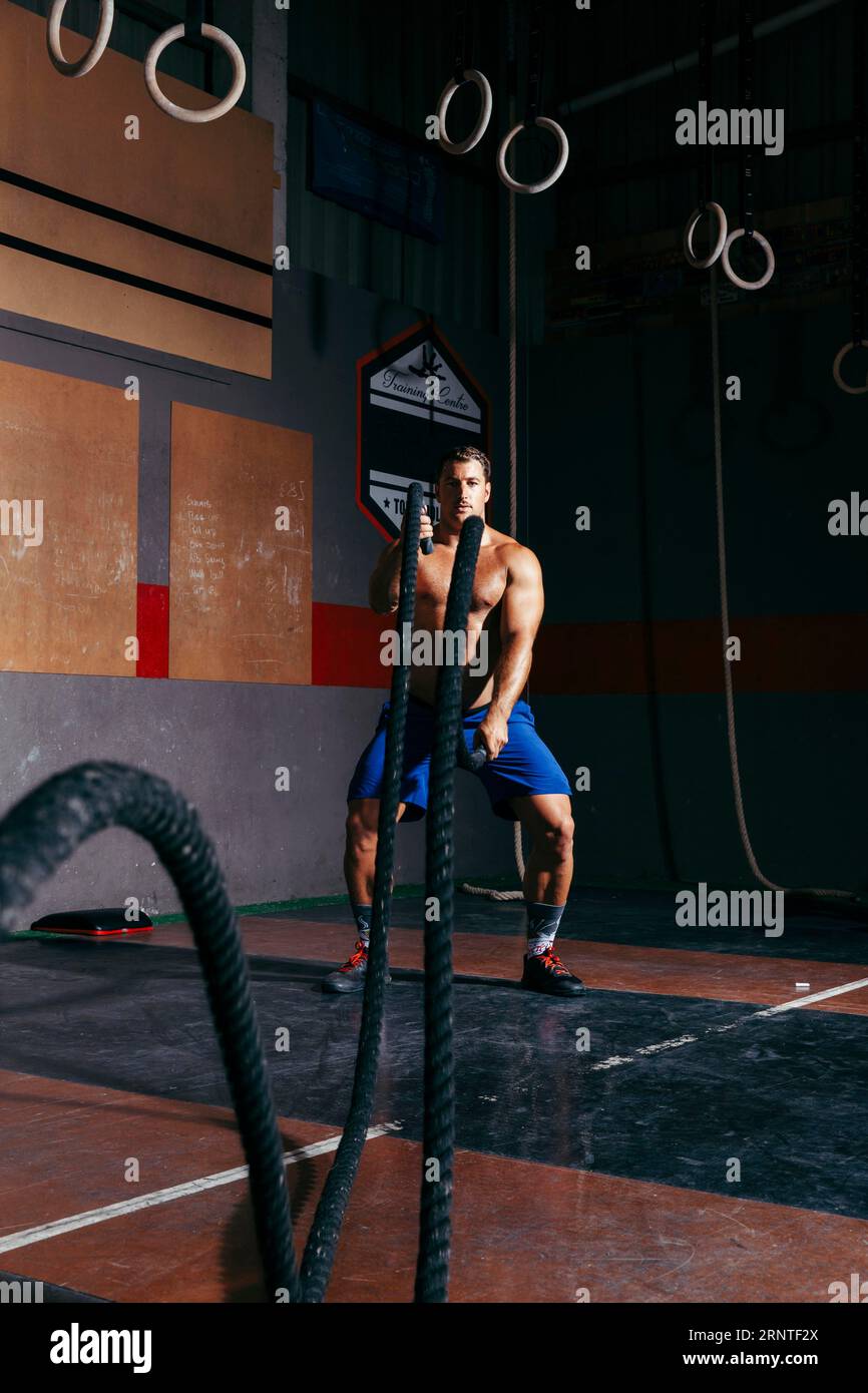 Man training with rope Stock Photo - Alamy