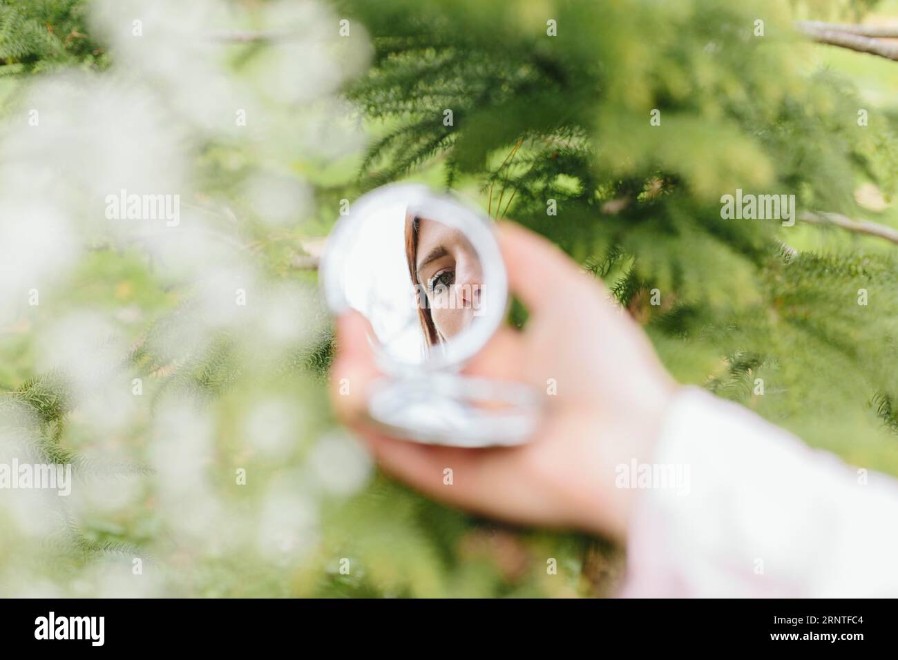 Reflection woman hand mirror Stock Photo - Alamy
