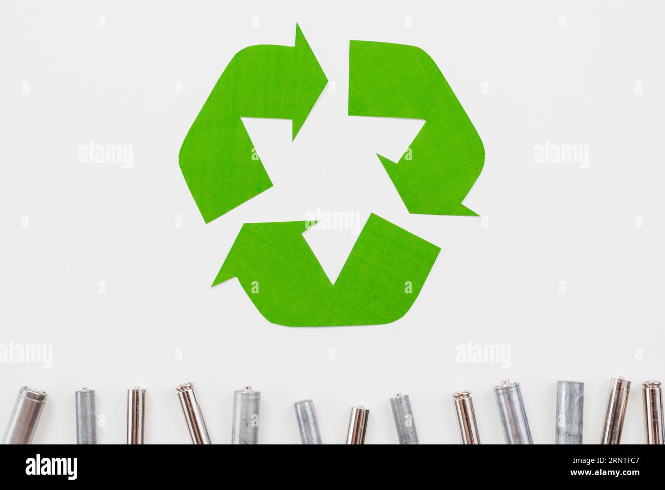 Recycle symbol garbage batteries grey background Stock Photo - Alamy