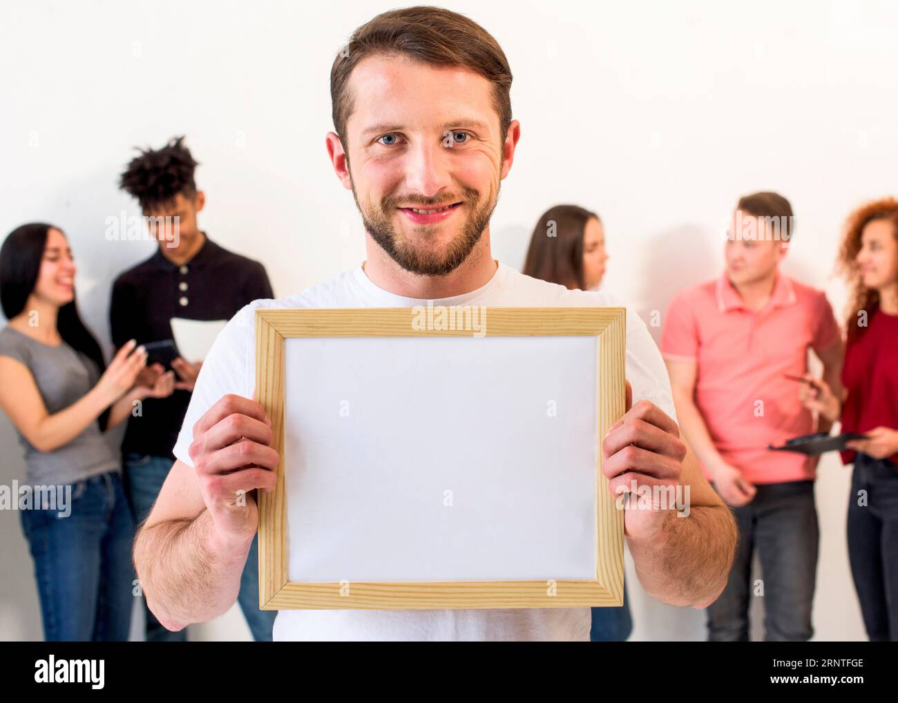 Man holding empty picture frame hi-res stock photography and images - Alamy