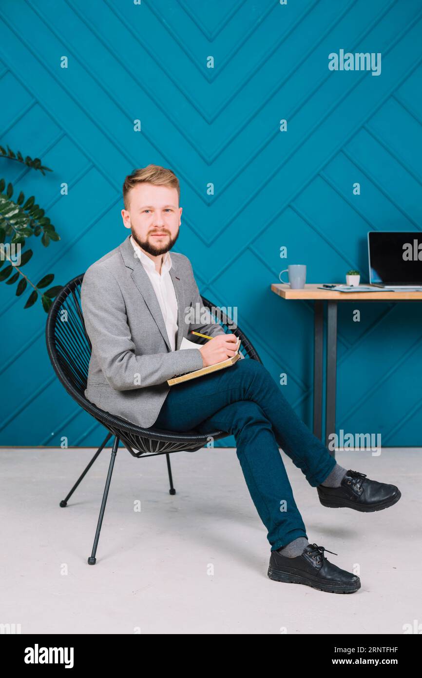 Portrait male psychologist writing note diary with pencil Stock Photo ...