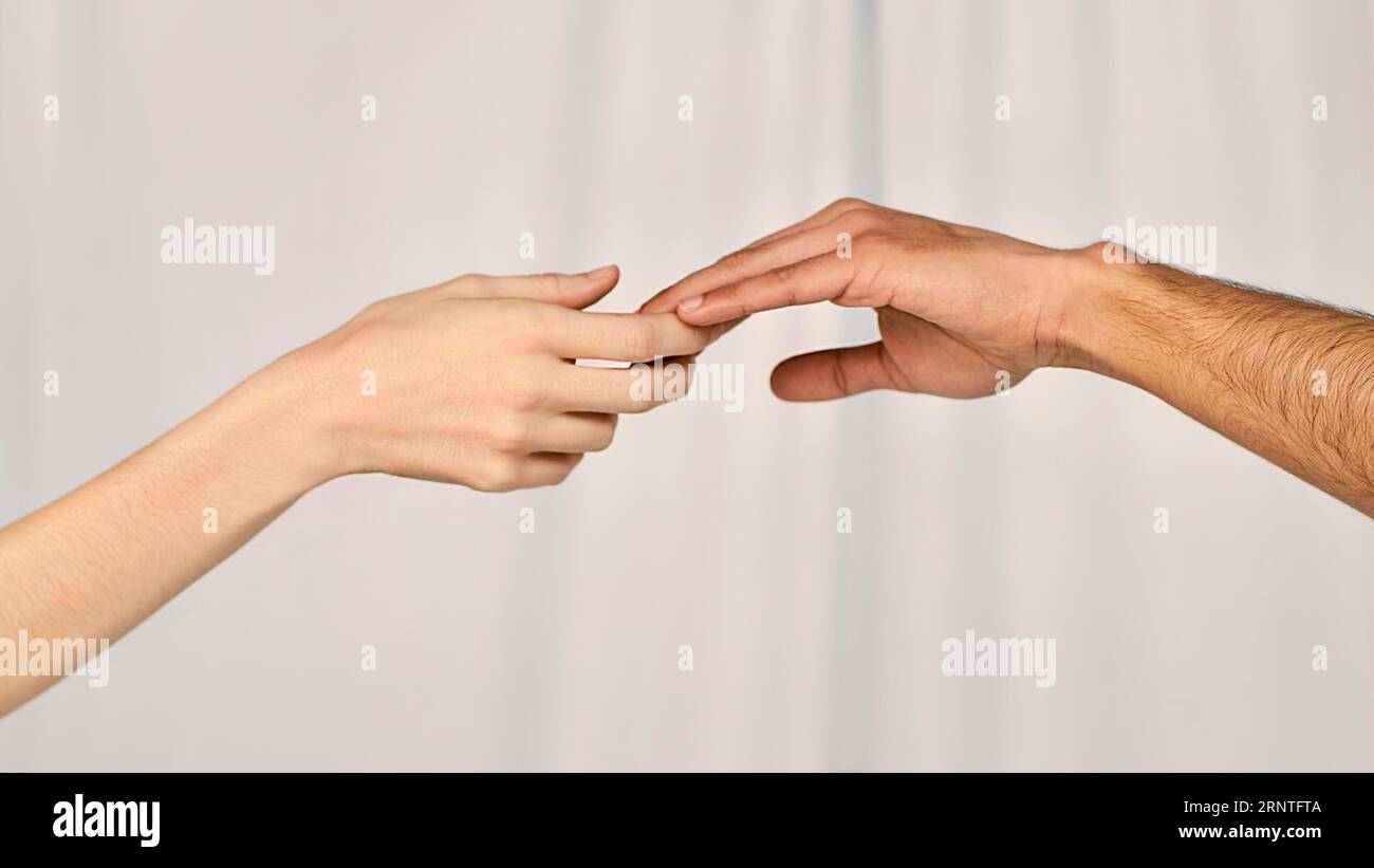 Side view couple holding hands Stock Photo - Alamy