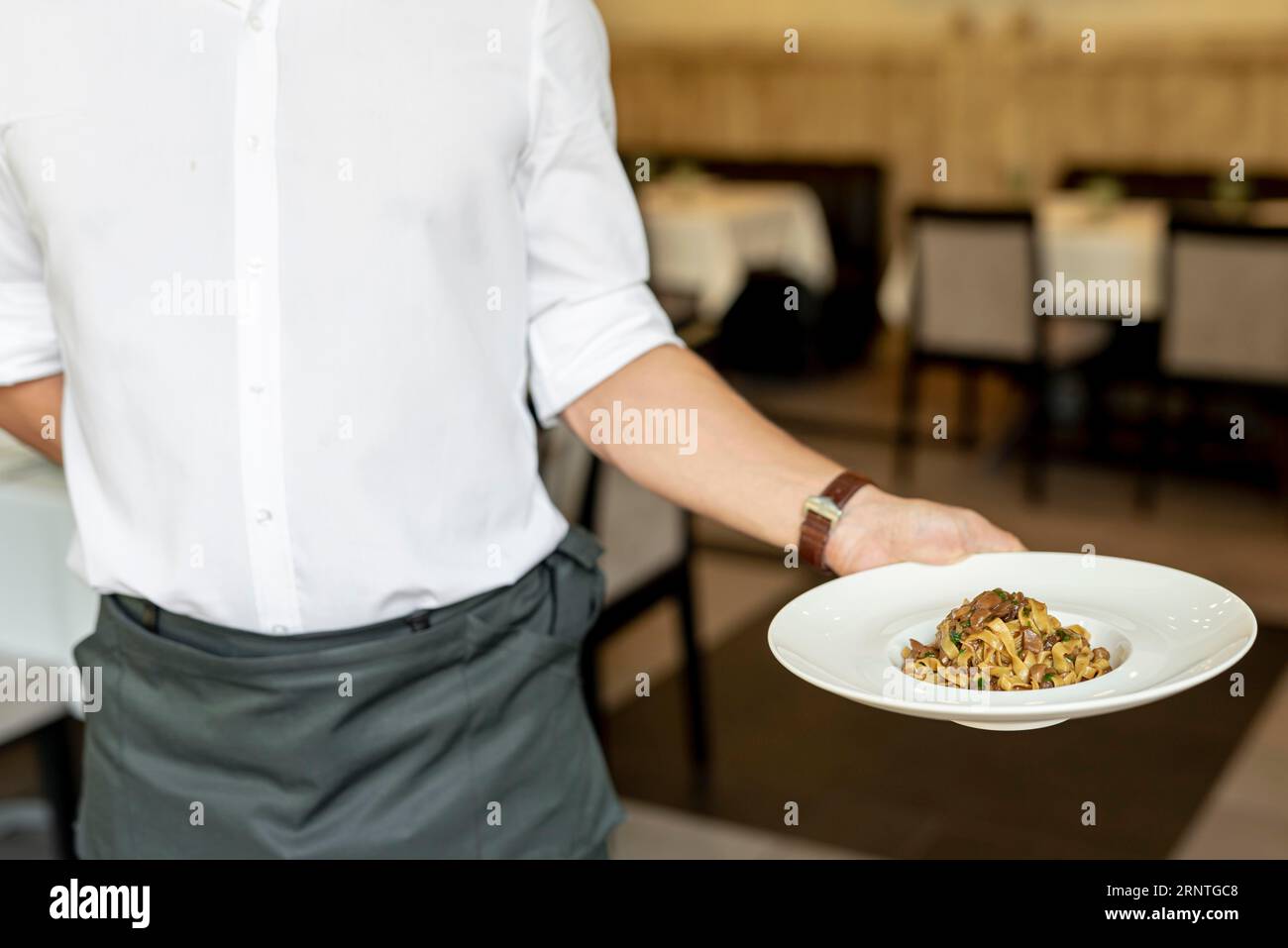 Waiter holding plate hi-res stock photography and images - Alamy