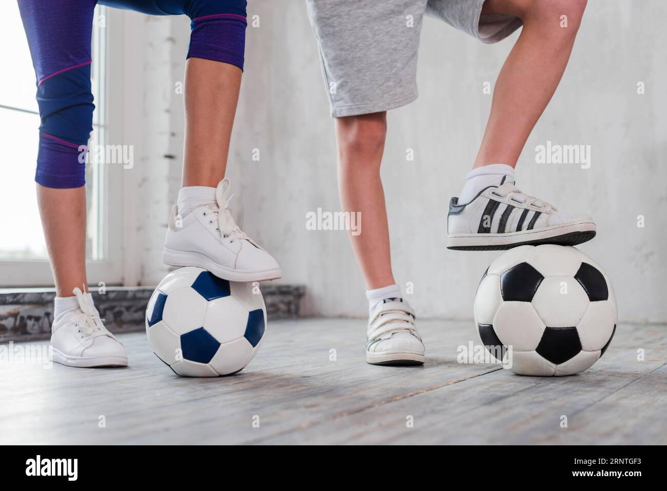 Girl boy s foot soccer ball Stock Photo - Alamy