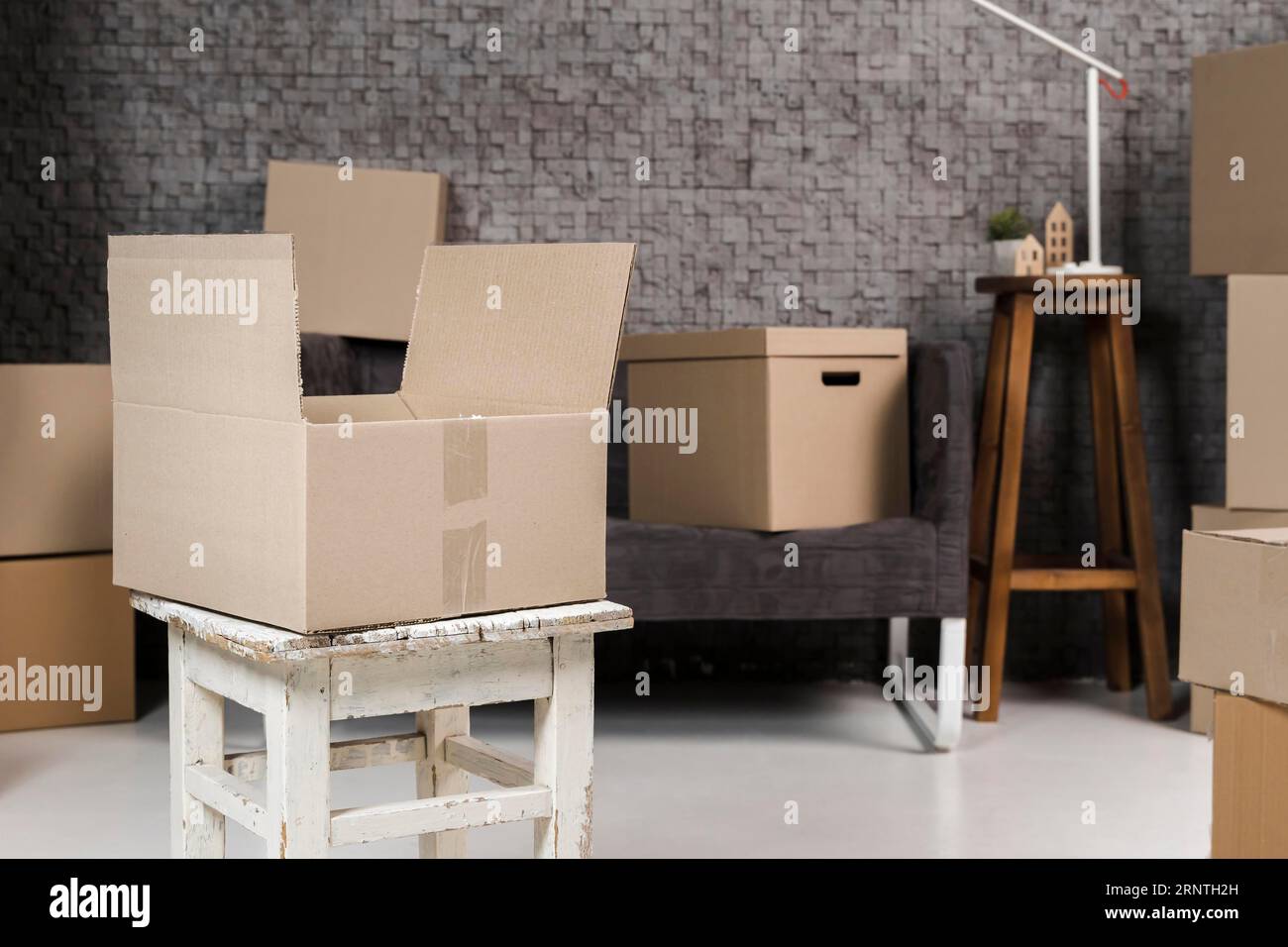 Variety cardboard boxes ready be moved Stock Photo - Alamy