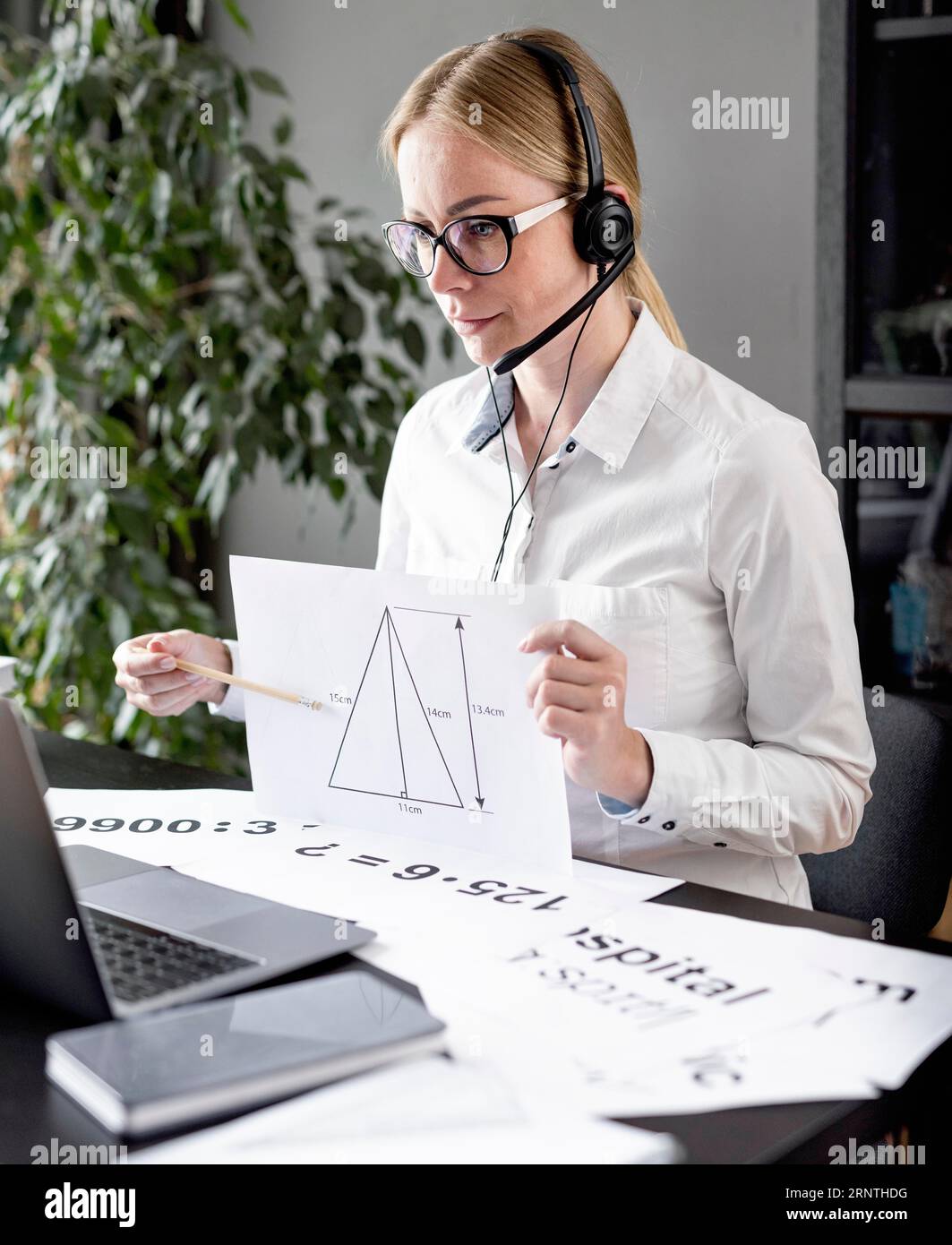 Woman teaching her students geometry Stock Photo - Alamy