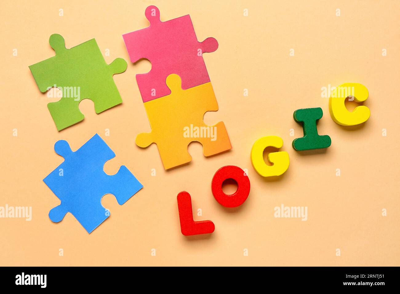 Word LOGIC with paper puzzle pieces on beige background Stock Photo - Alamy
