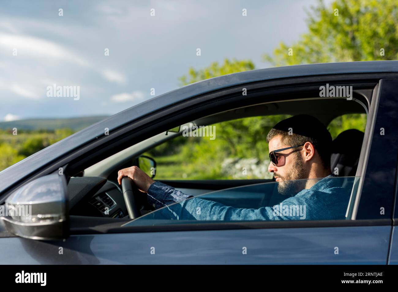 Brutal bearded man driving car hi-res stock photography and images - Alamy
