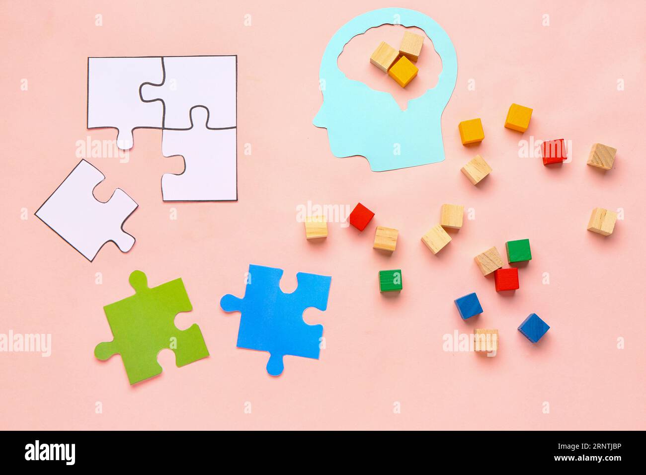 Paper human head with cubes and puzzle pieces on pink background. Logic ...