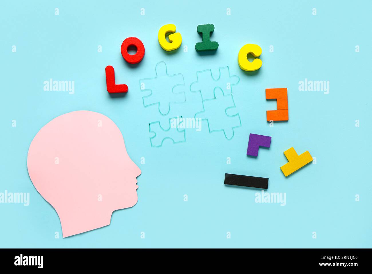 Word LOGIC with drawn puzzle pieces, blocks and paper human head on ...