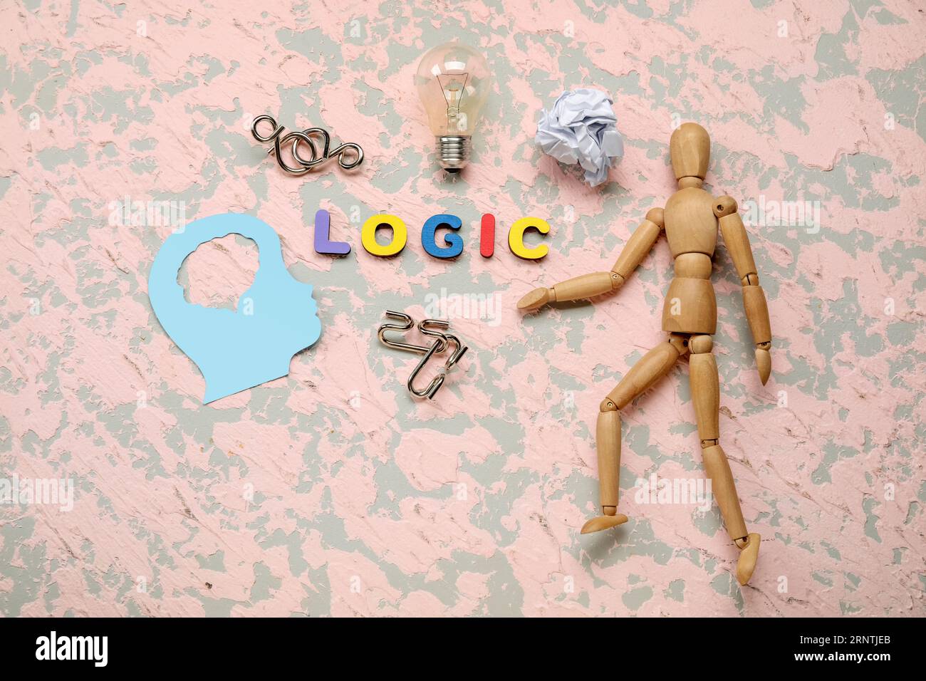 Word LOGIC with toys, paper human head and light bulb on grunge ...