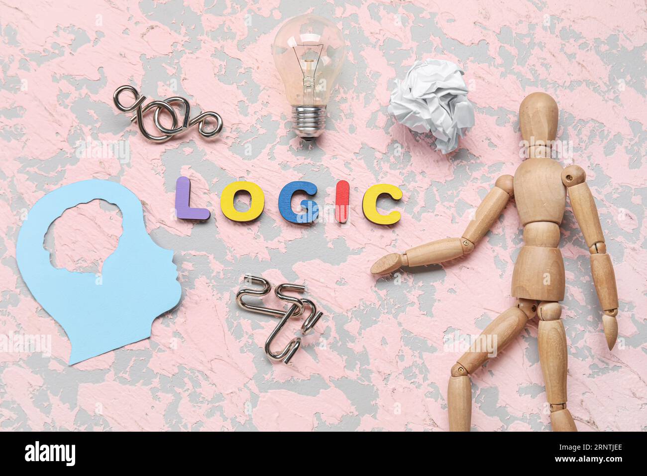Word LOGIC with toys, paper human head and light bulb on grunge ...
