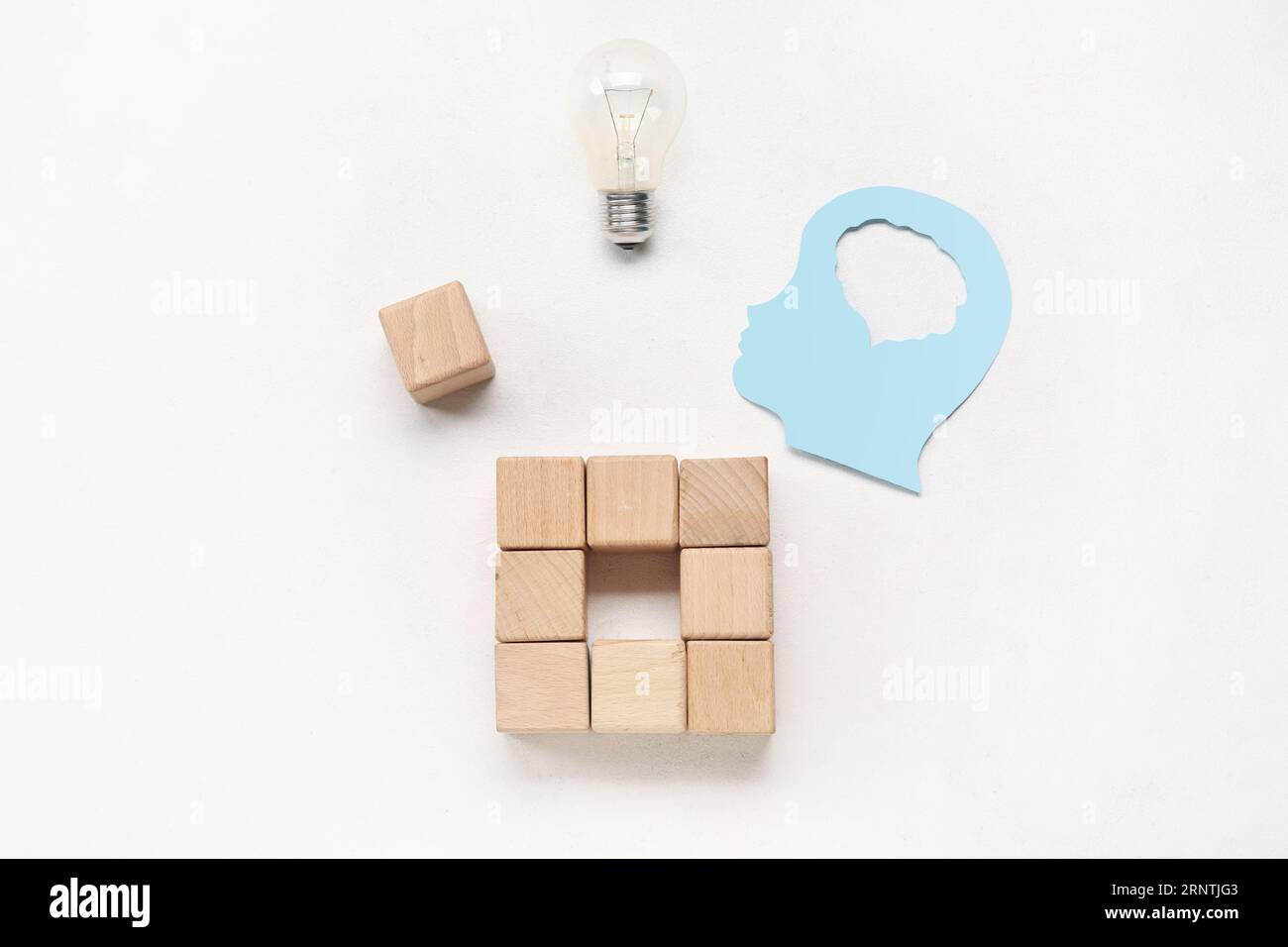 Paper human head with light bulb and cubes on white background. Logic ...