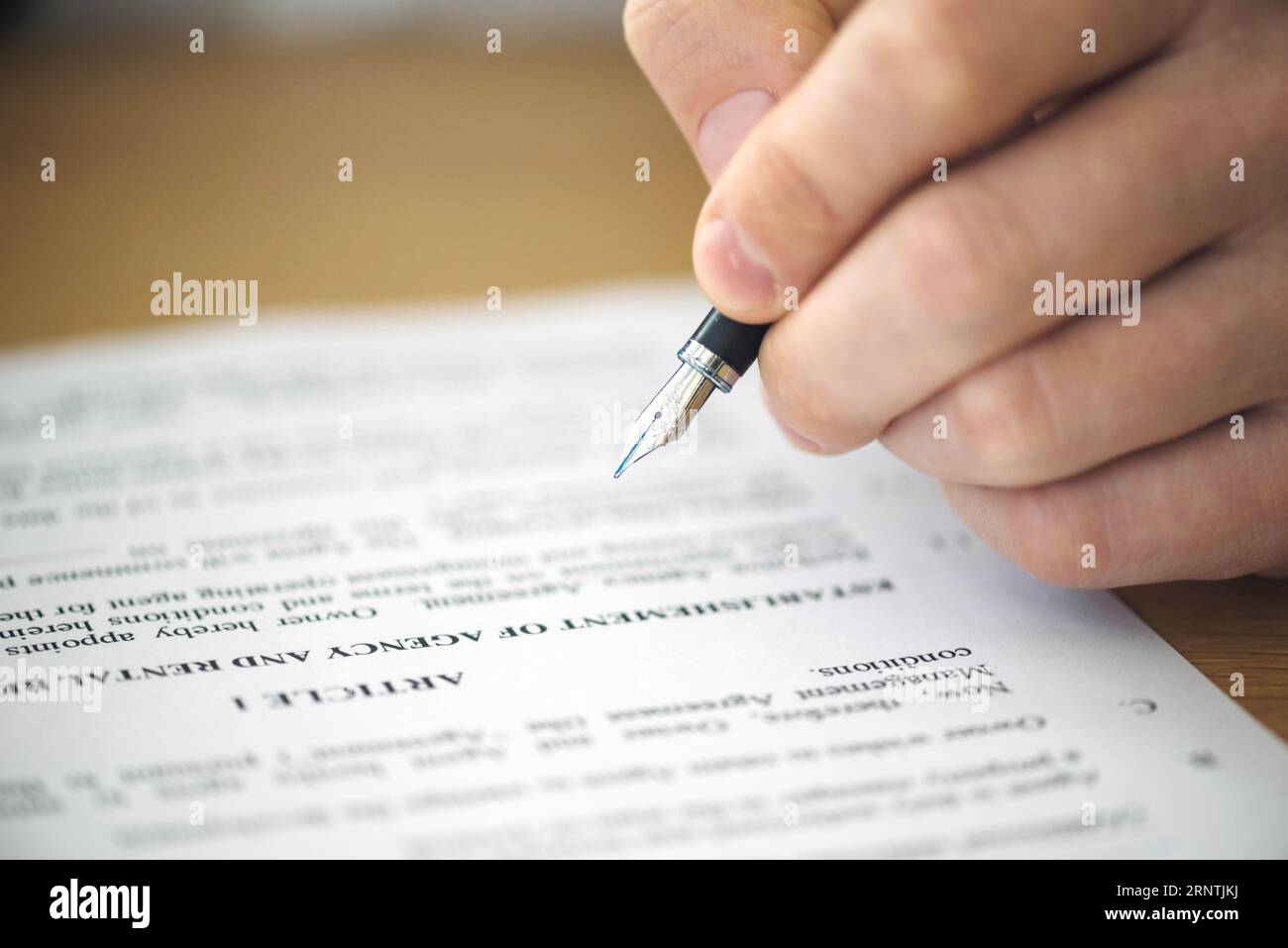 Close up businessman signing hi-res stock photography and images - Alamy