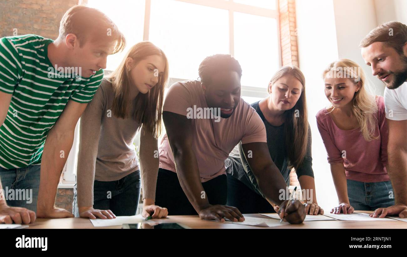 Group friends planning together Stock Photo - Alamy