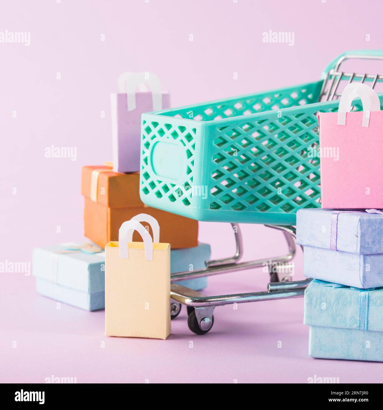 Grocery cart with colourful gift boxes Stock Photo - Alamy