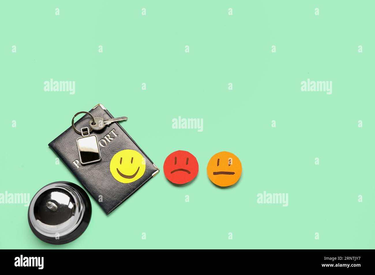 Rating smiles with passport, key from hotel room and service bell on ...