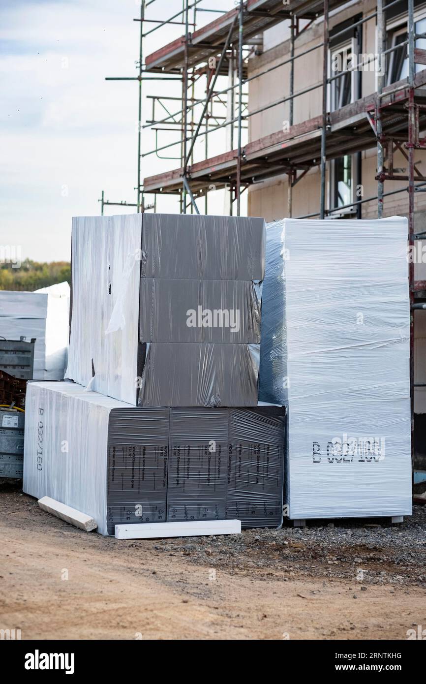 Stacked insulation boards in front of a house under construction Stock ...