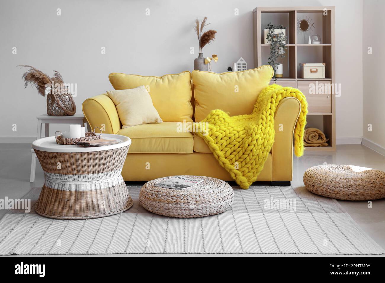 Interior of light living room with stylish yellow sofa, coffee table ...