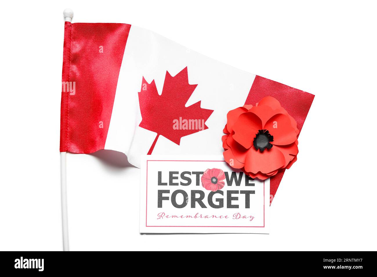 Poppy flower, flag of Canada and card with text LEST WE FORGET on white background. Remembrance ...