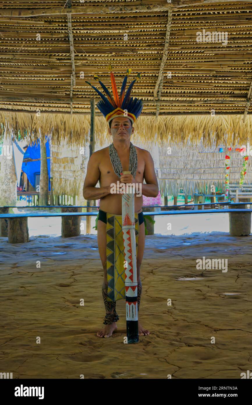 Tuyuca native man with a traditional great flute Music instrument ...