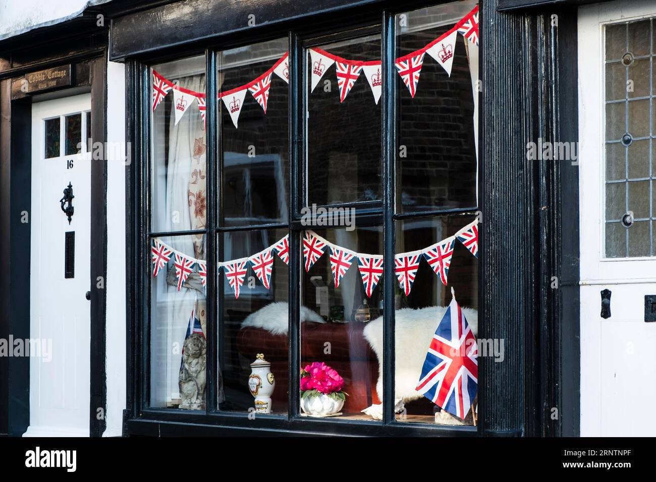 Window with Union Jack flags on the occasion of the coronation of King ...