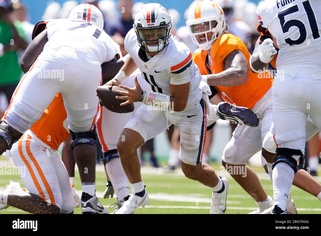 Virginia quarterback Tony Muskett (11) rushes out of the pocket in the ...