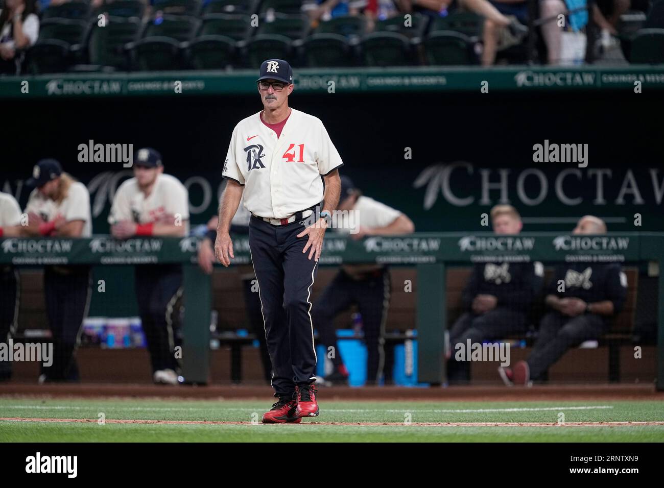 Texas Rangers pitching coach Mike Maddux walks out for a mound visit ...