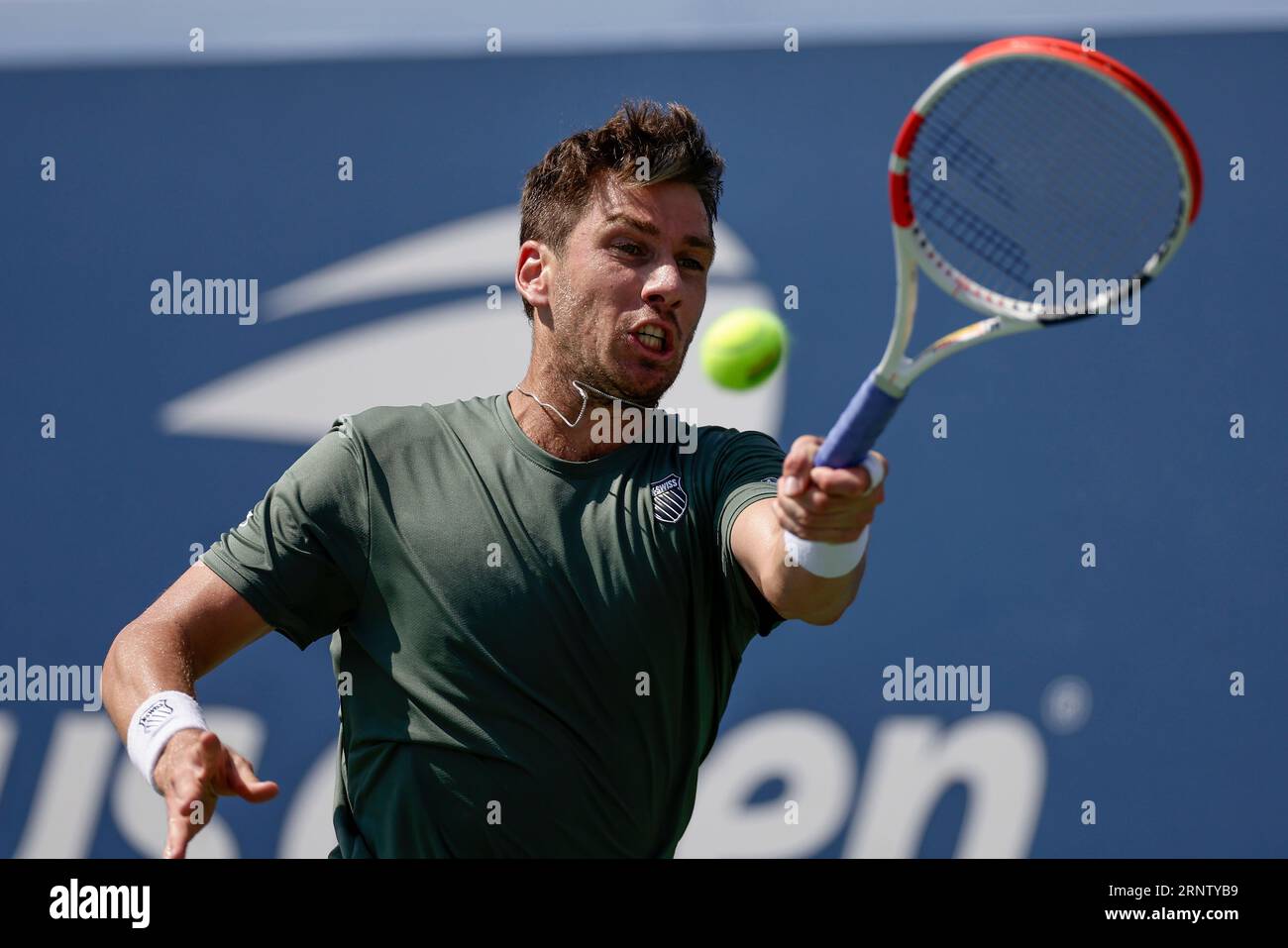 Cameron Norrie, of Great Britain, returns a shot to Matteo Arnaldi, of ...
