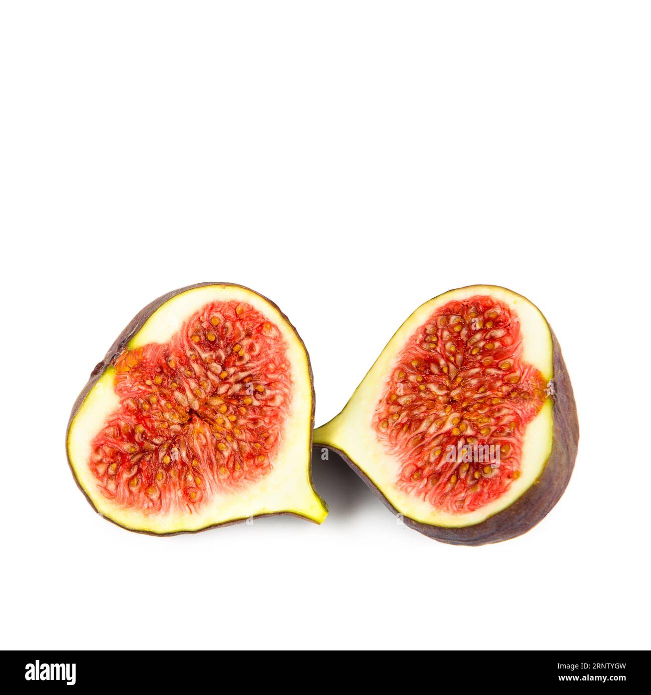Two halves of fig fruit isolated on white background. Free space for ...