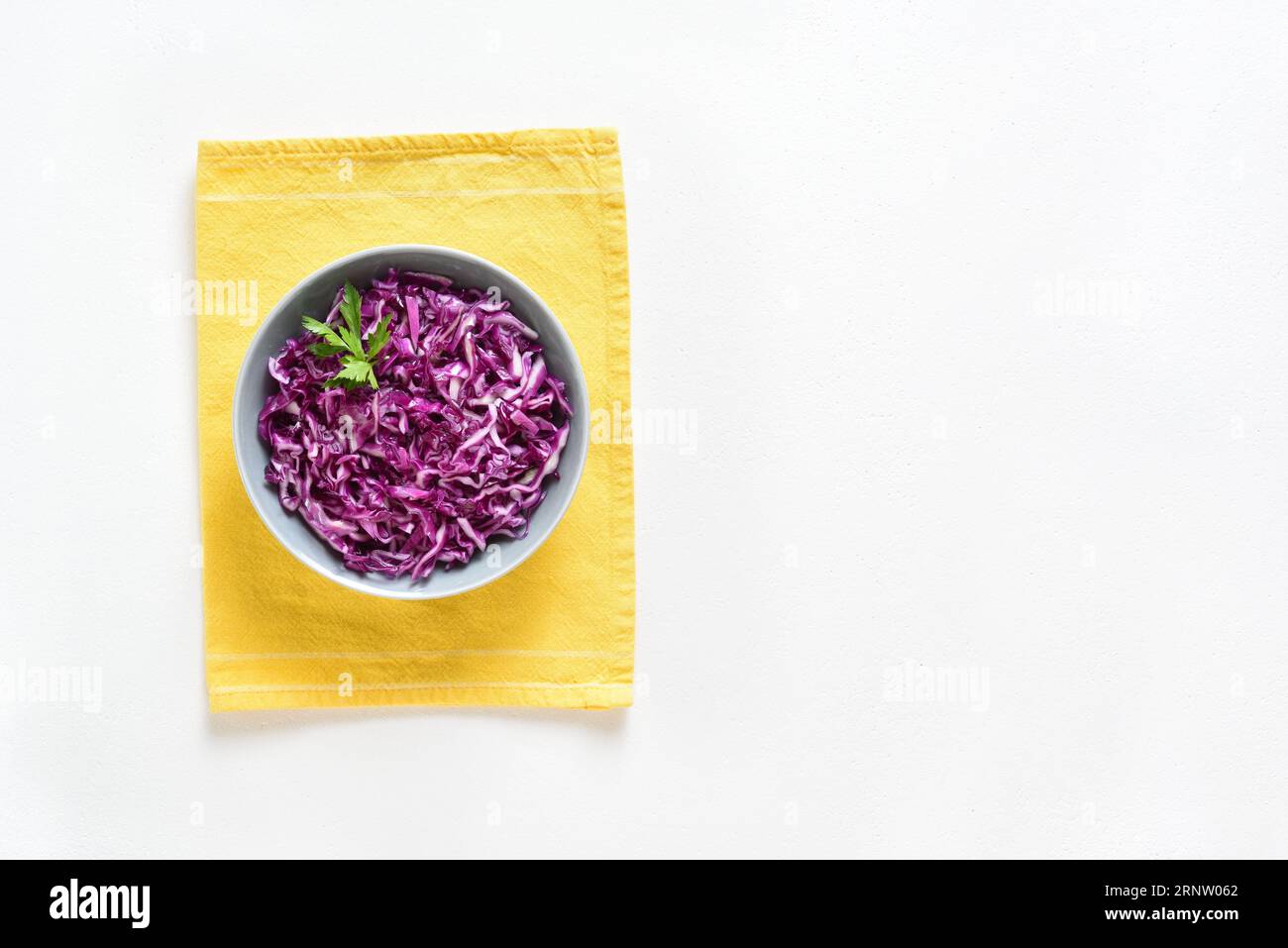Red cabbage in bowl over white stone background with free space. Top ...