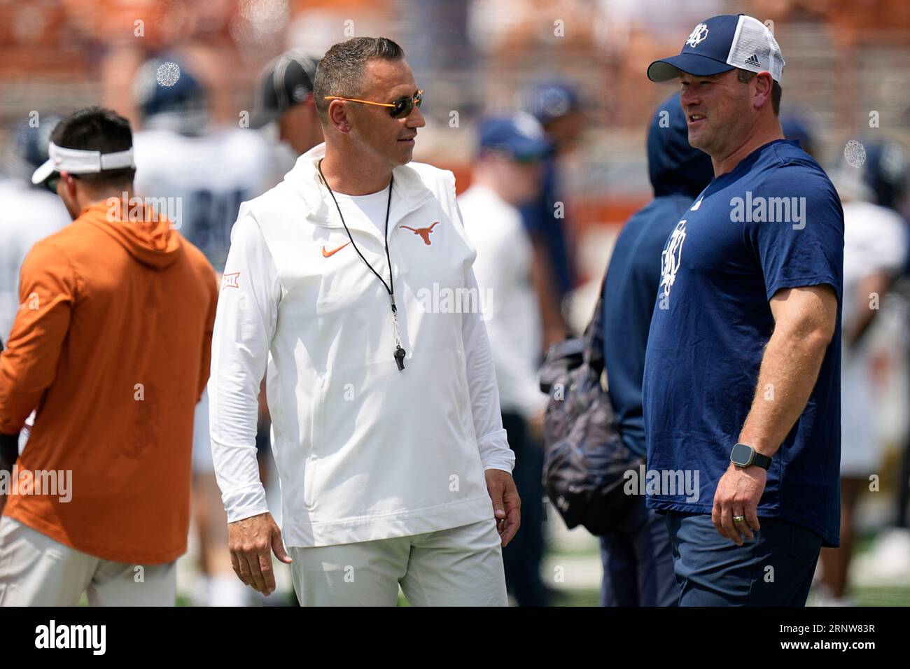 Texas head coach Steve Sarkisian, left, talks with Rice head coach Mike ...
