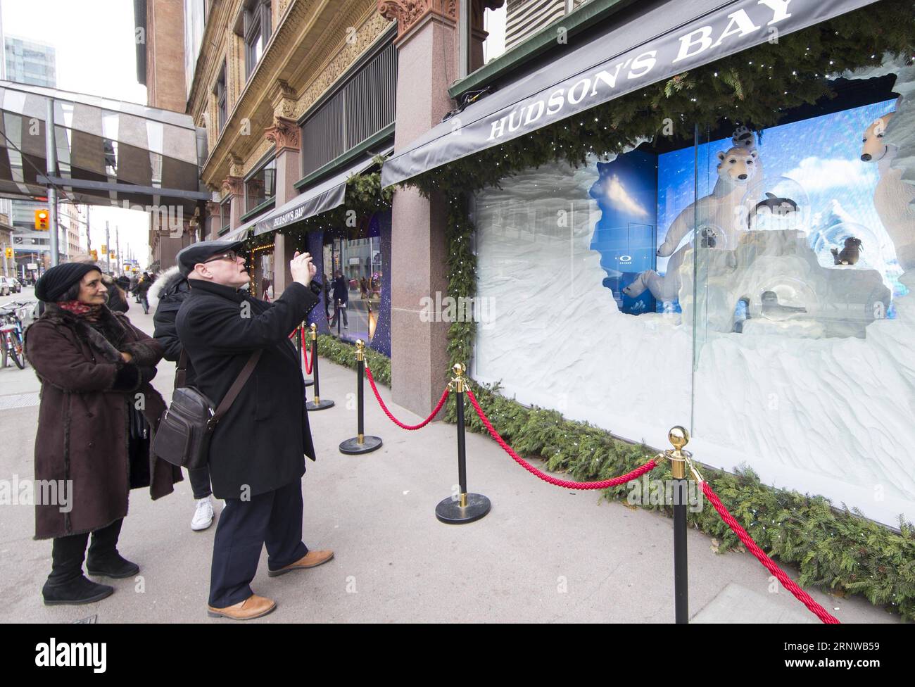 (171211) -- TORONTO, Dec. 11, 2017 -- People look at the holiday window ...