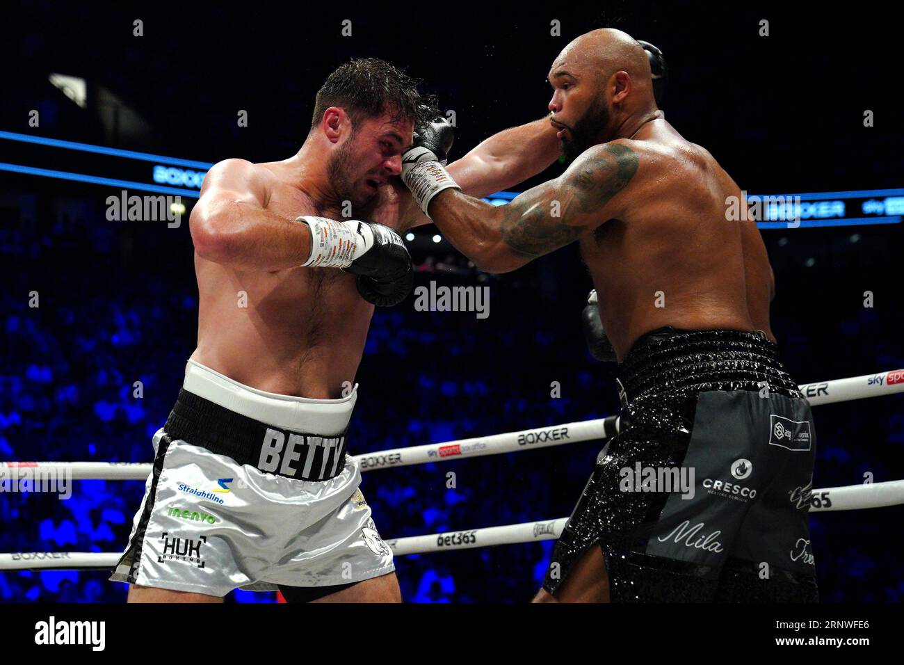 Frazer Clarke (right) strikes David Allen in the heavyweight bout at ...
