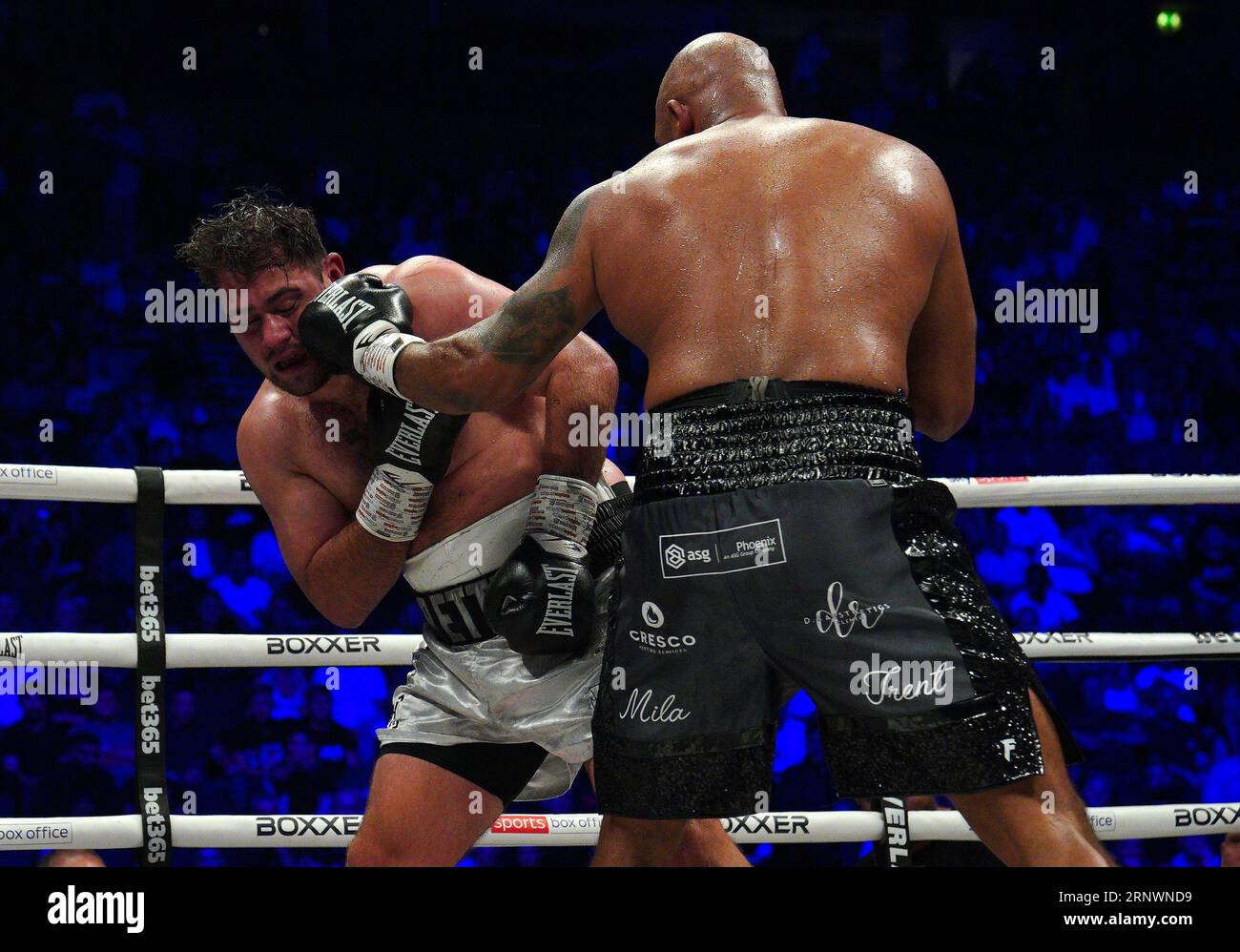 Frazer Clarke (right) strikes David Allen in the heavyweight bout at ...