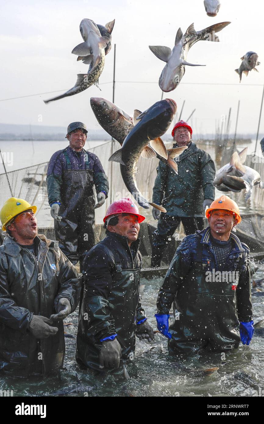 (171231) -- BEIJING, Dec. 31, 2017 -- People catch fish at Maoer lake ...