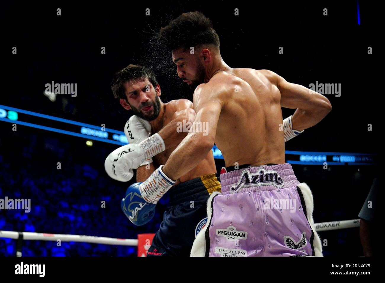 Aram Fanyan (left) strikes Adam Azim in the Super-Lightweight Title ...