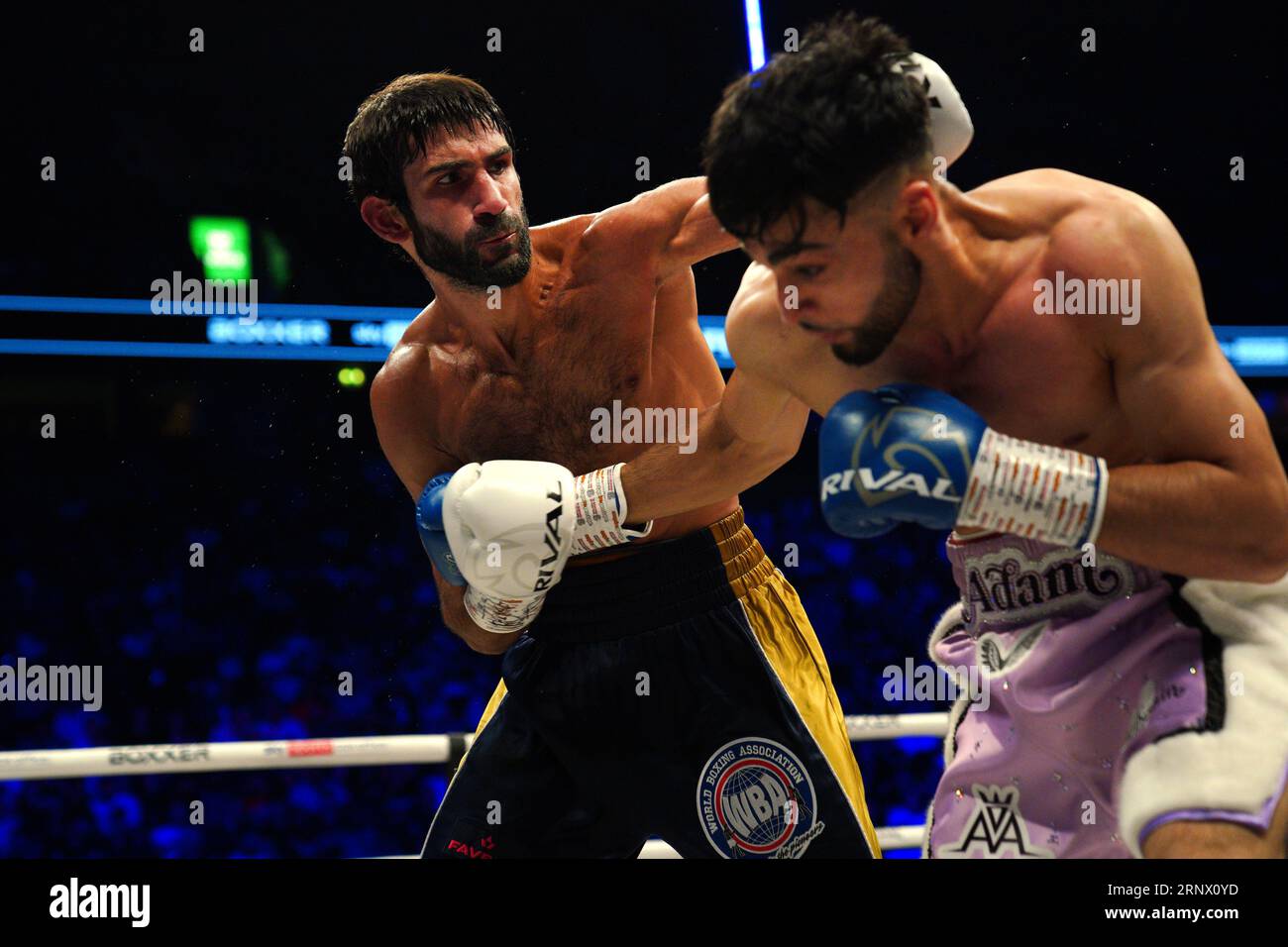 Aram Fanyan (left) strikes Adam Azim in the Super-Lightweight Title ...