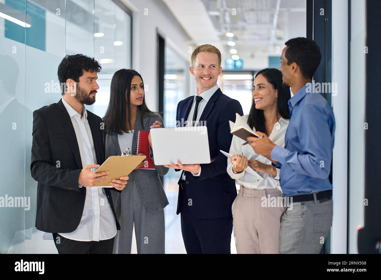 Happy diverse professional team young business people talking in office ...