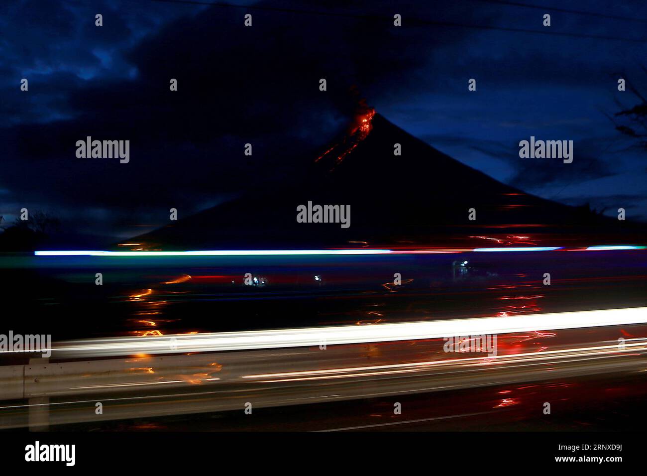 (180123) -- ALBAY, Jan. 23, 2018 -- Light trails from passing vehicles ...