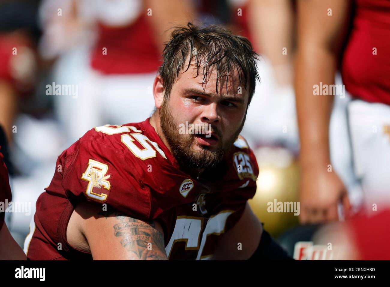Boston College offensive lineman Logan Taylor (65) sits on the bench ...