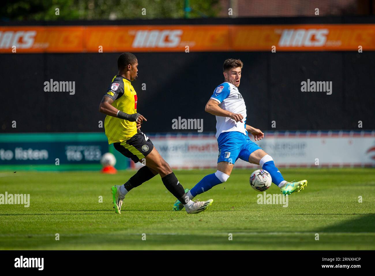 Harrogate Town's Kayne Ramsay in action with Barrow's Kian Spence ...