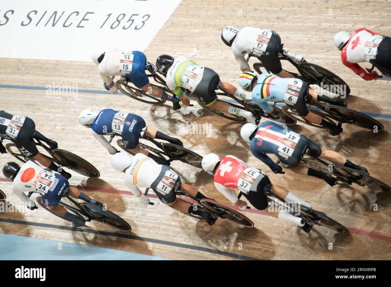 Riders in the men's omnium ride within inches of each other during the ...