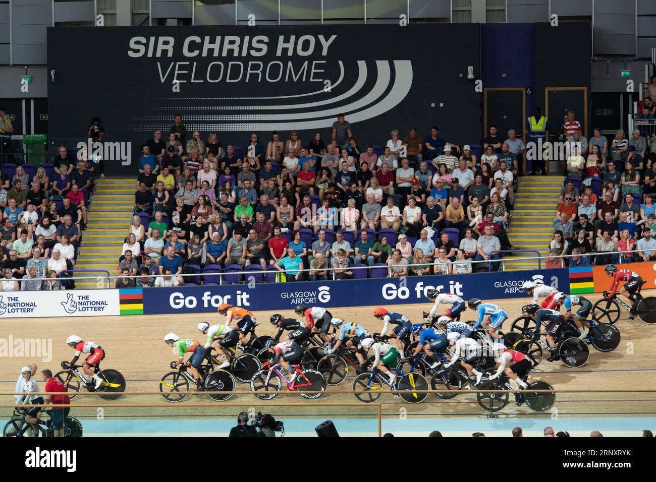 Track Cycling fans cheer on riders in the scratch race in the men's ...